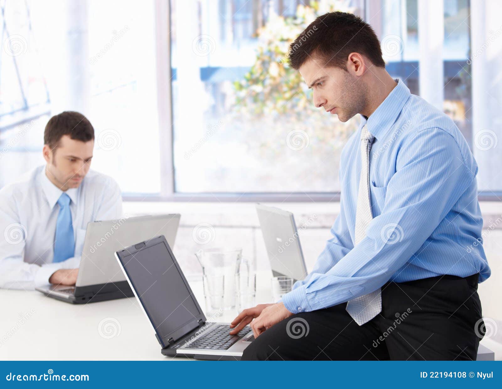 Young Businessmen Working on Laptop Stock Photo - Image of businessmen ...