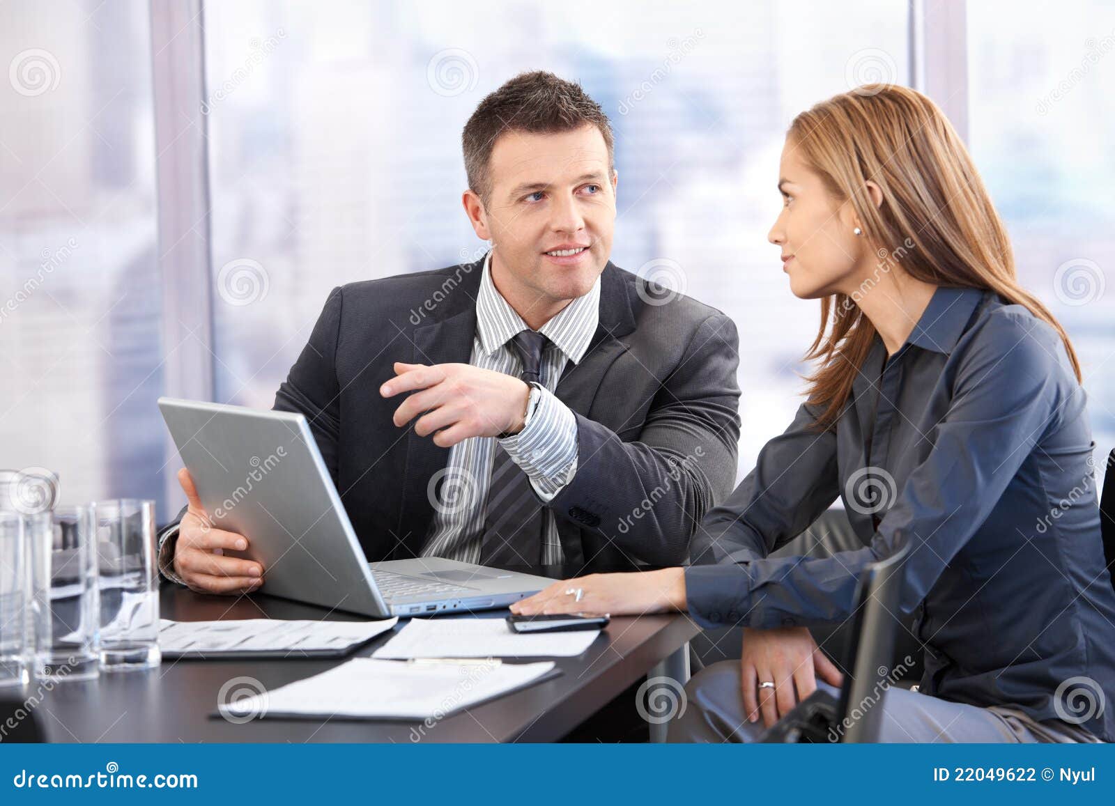Young Businesspeople Negotiating Stock Photo - Image of attractive ...