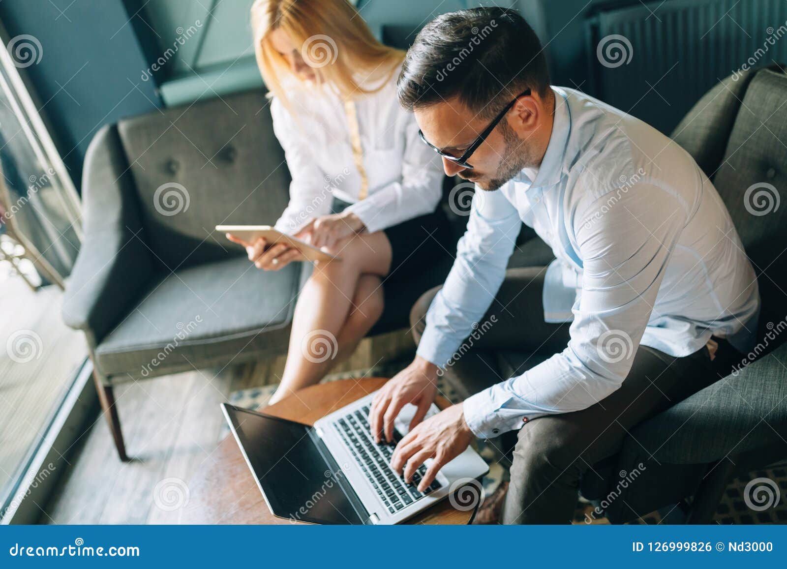 Young Businesspeople Working on Computer in Office Stock Photo - Image ...