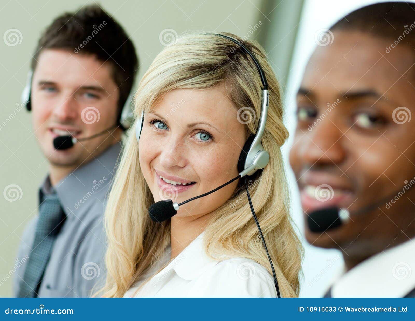 Young Businesspeople Working with Headsets Stock Image - Image of ...