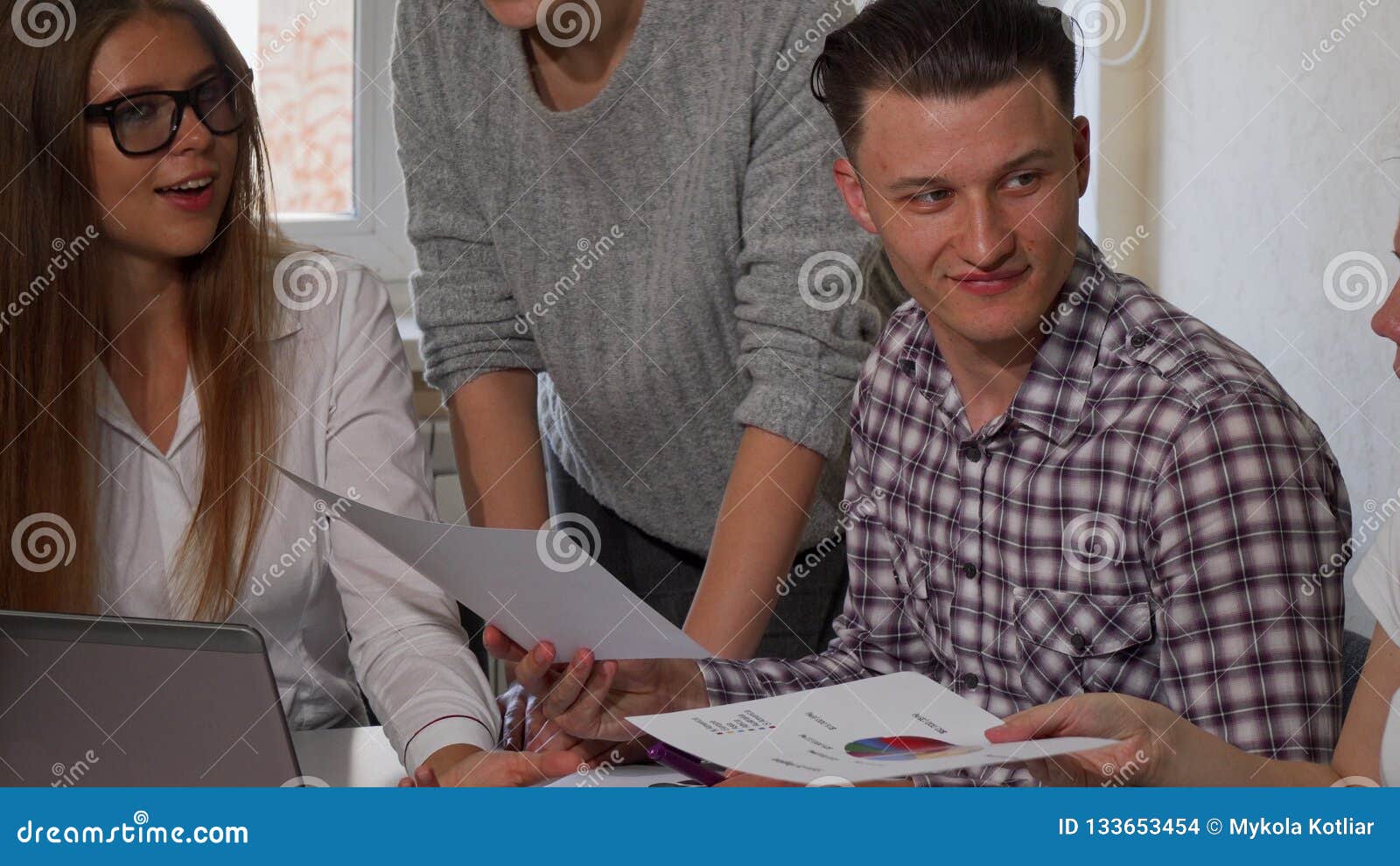 Young Businesspeople Working Together in the Office, Doing Paperwork ...