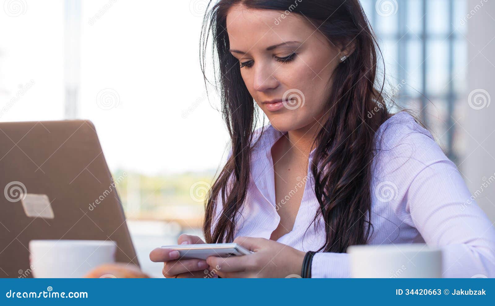 Young Businesswoman on a Coffee Break Using Mobile Phone. Stock Image ...
