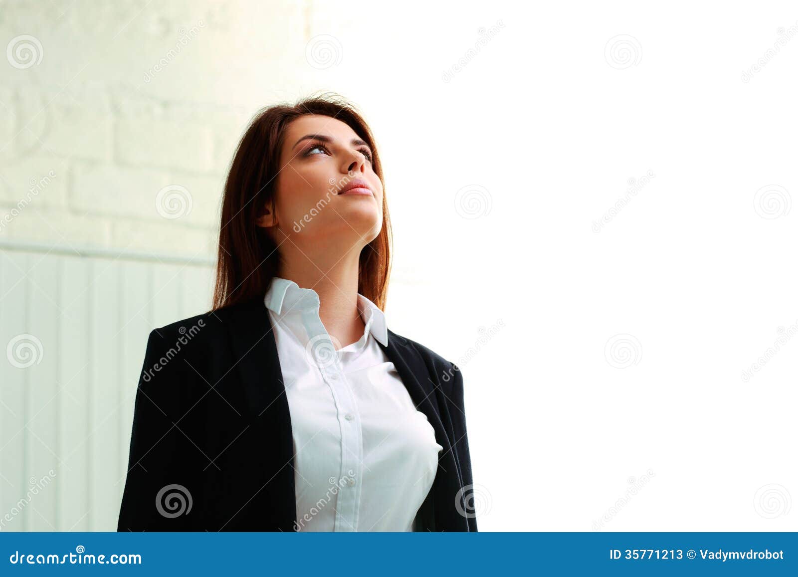 Young Businesswoman Looking Up at Copyspace Stock Image - Image of ...
