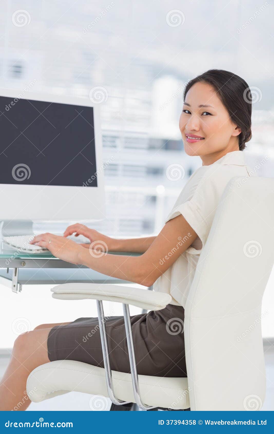 Young Businesswoman Using Computer in Office Stock Photo - Image of ...