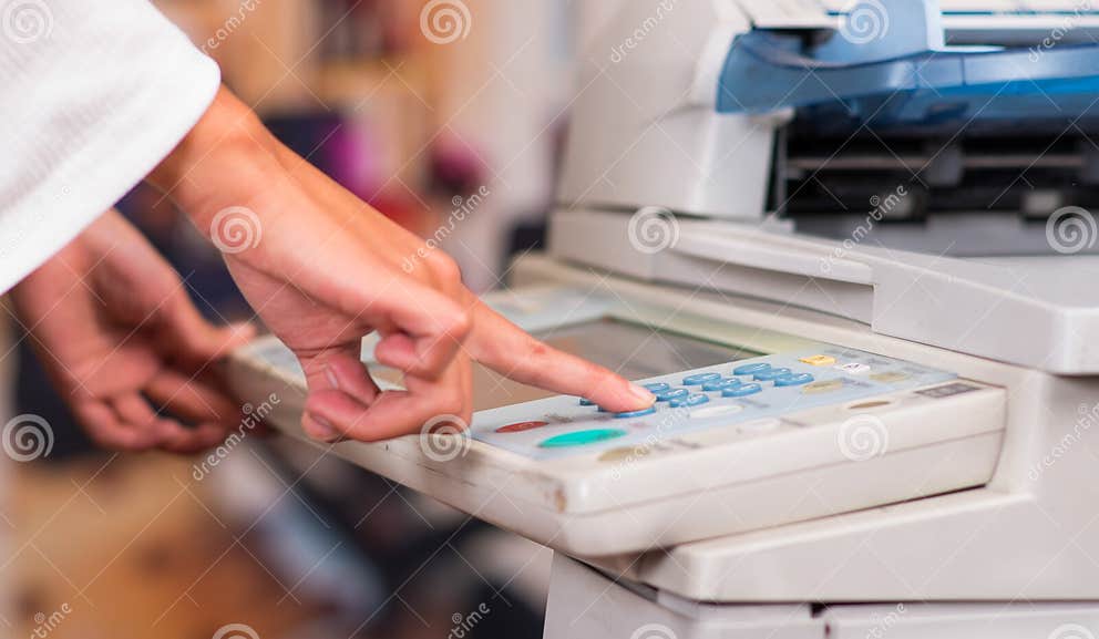 Young Businesswoman Using Copy Machine at the Office Stock Image ...