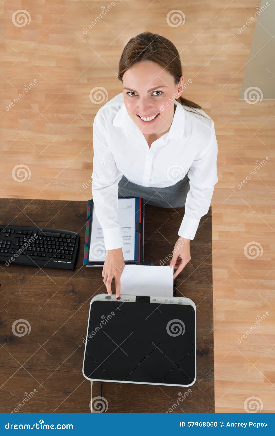 Young Businesswoman Using Printer in Office Stock Photo - Image of ...