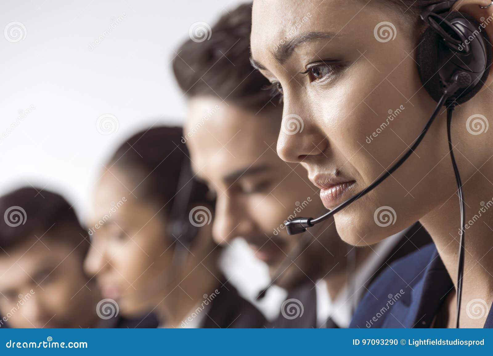 Young Call Center Operator in Headset Working with Colleagues Stock ...