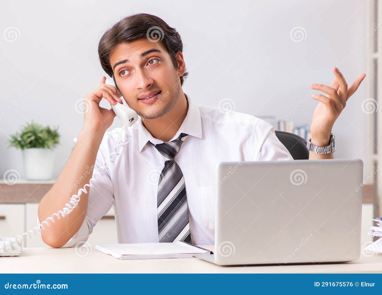 Young Call Center Operator Speaking on Phone Stock Photo - Image of ...