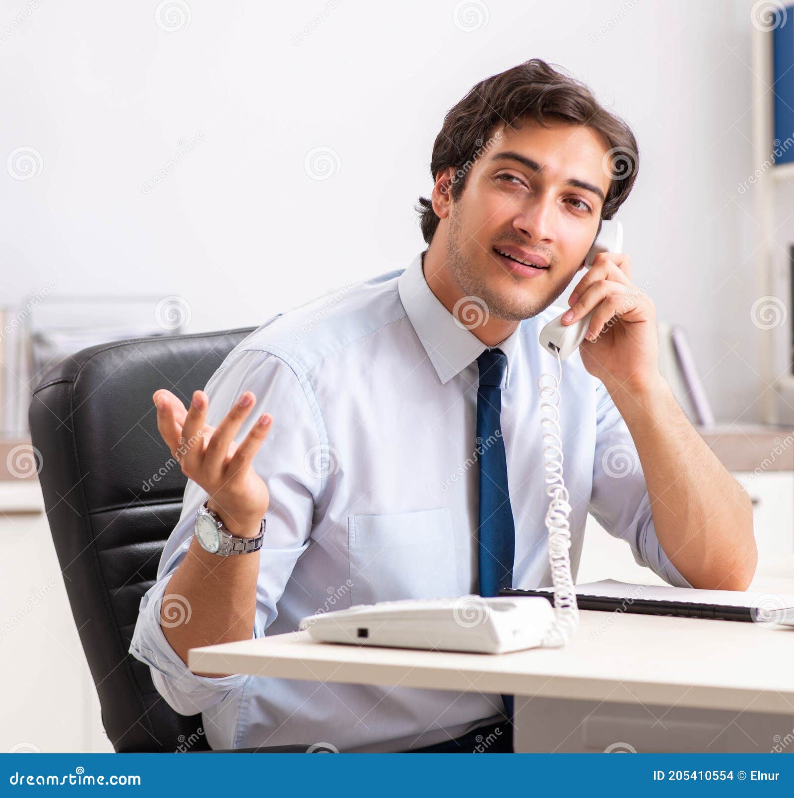 Young Call Center Operator Speaking on Phone Stock Photo - Image of ...