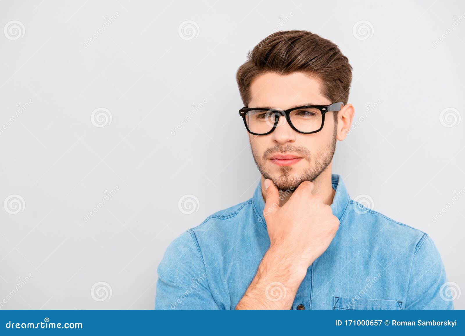 Young Calm Guy in Glasses Dreaming and Touching Chin Stock Image ...