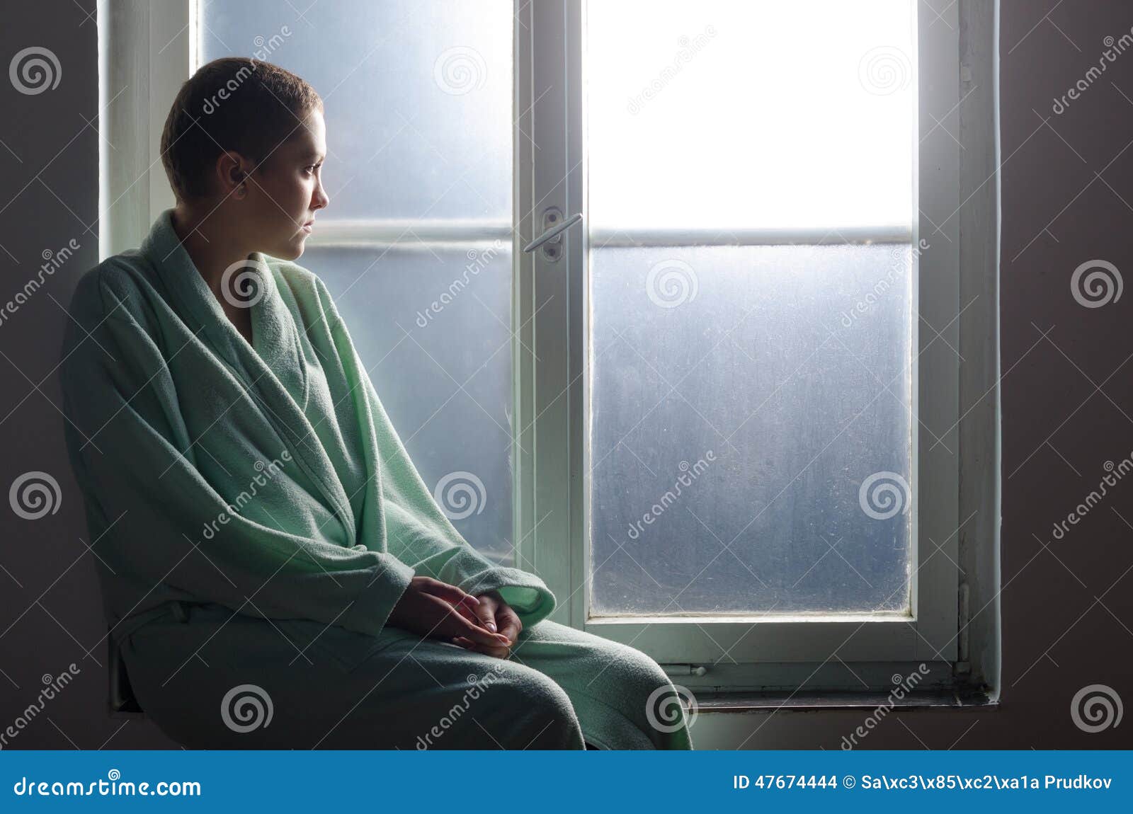 Young Cancer Patient Sitting in Front of Hospital Window Stock Photo ...