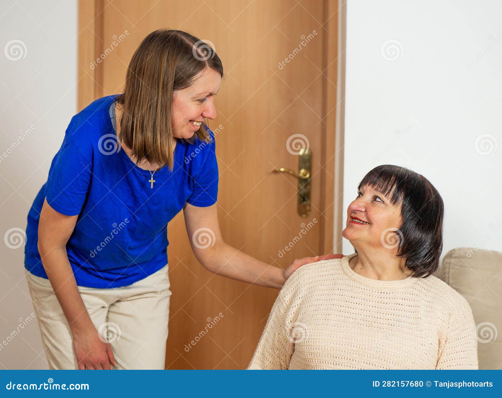 Young Caregiver Helping Senior Woman At Home Caring Nurse Assisting