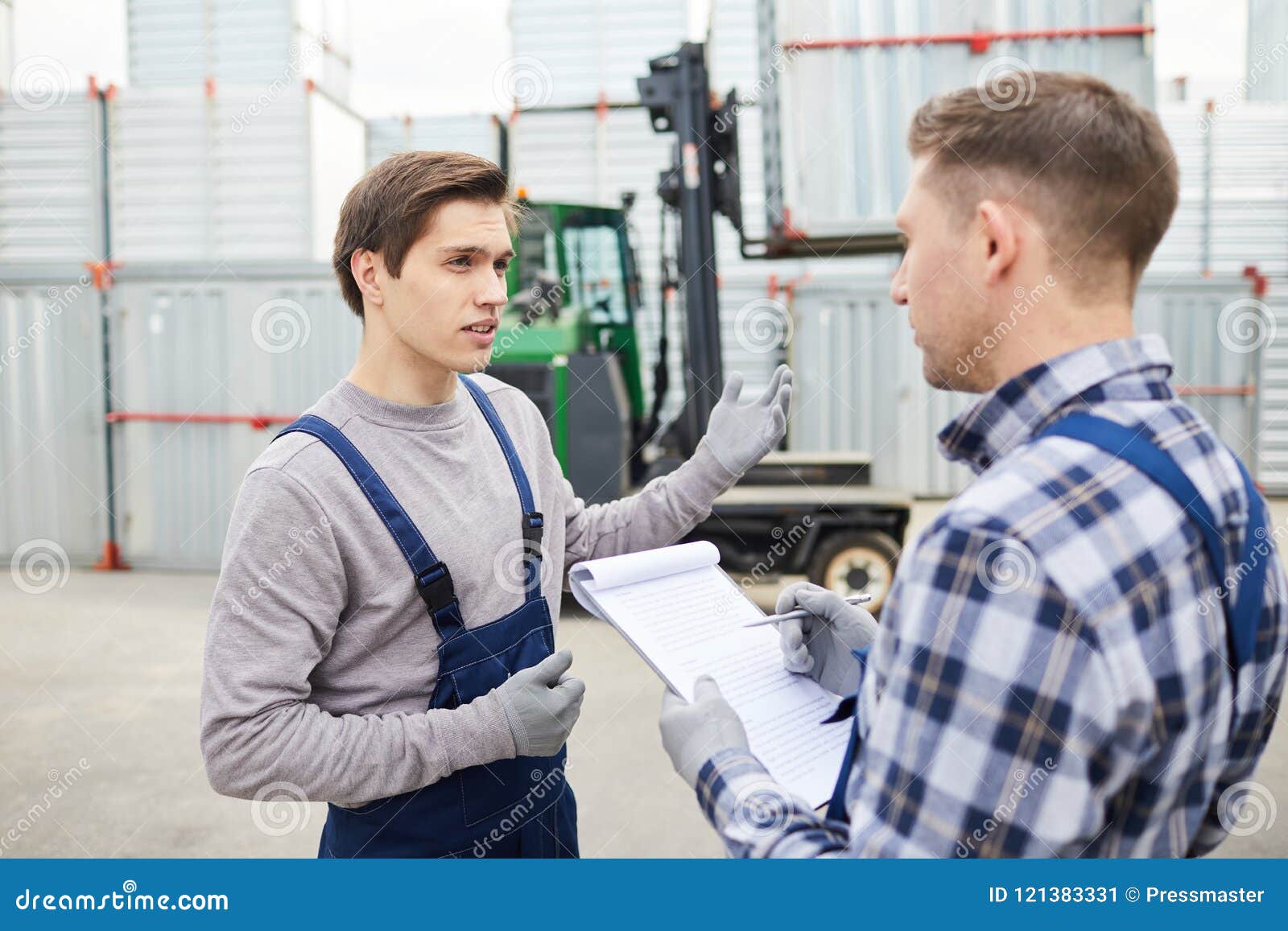 Young Cargo Employee Asking Foreman about Loading Stock Image - Image ...