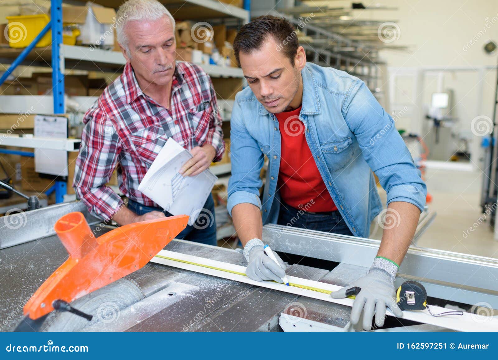 Young Carpenter and Manager Measuring Wood in Workshop Stock Image ...
