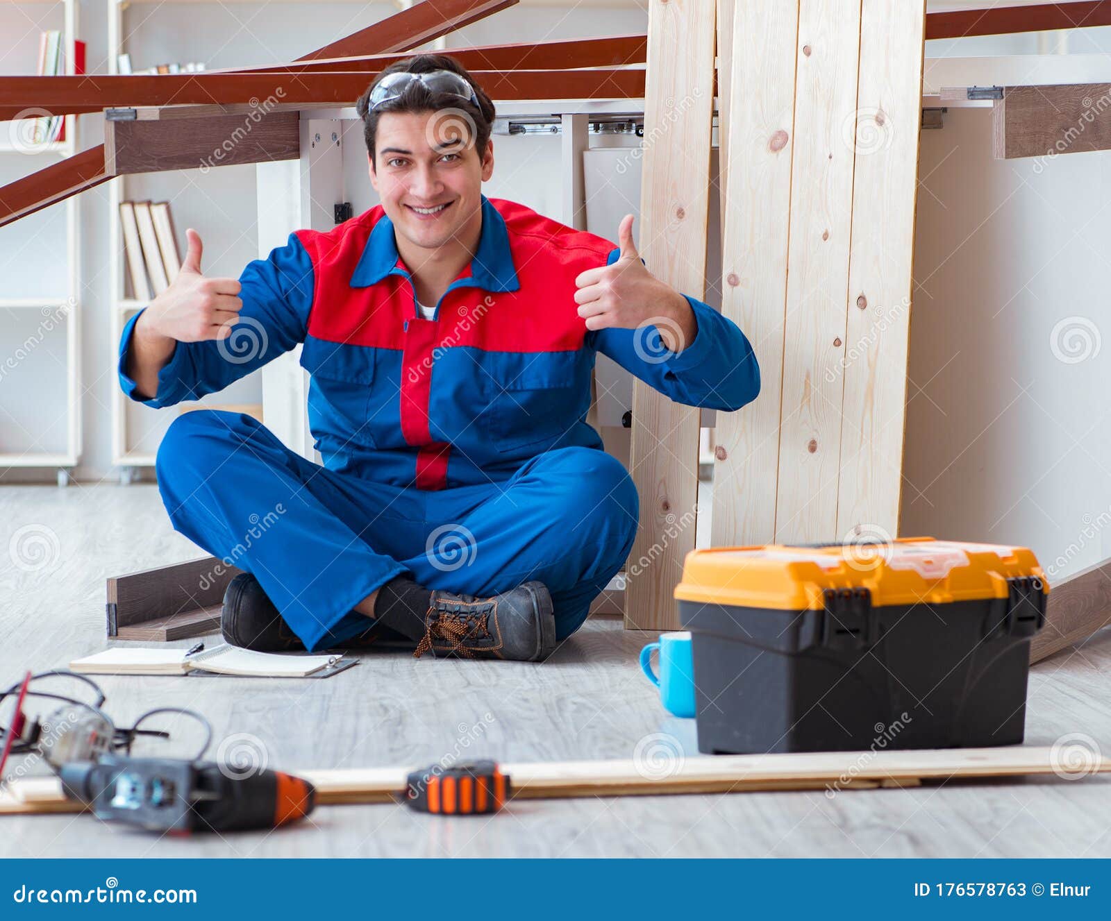 Young Carpenter with Notebook Writing Planning at Construction R Stock ...