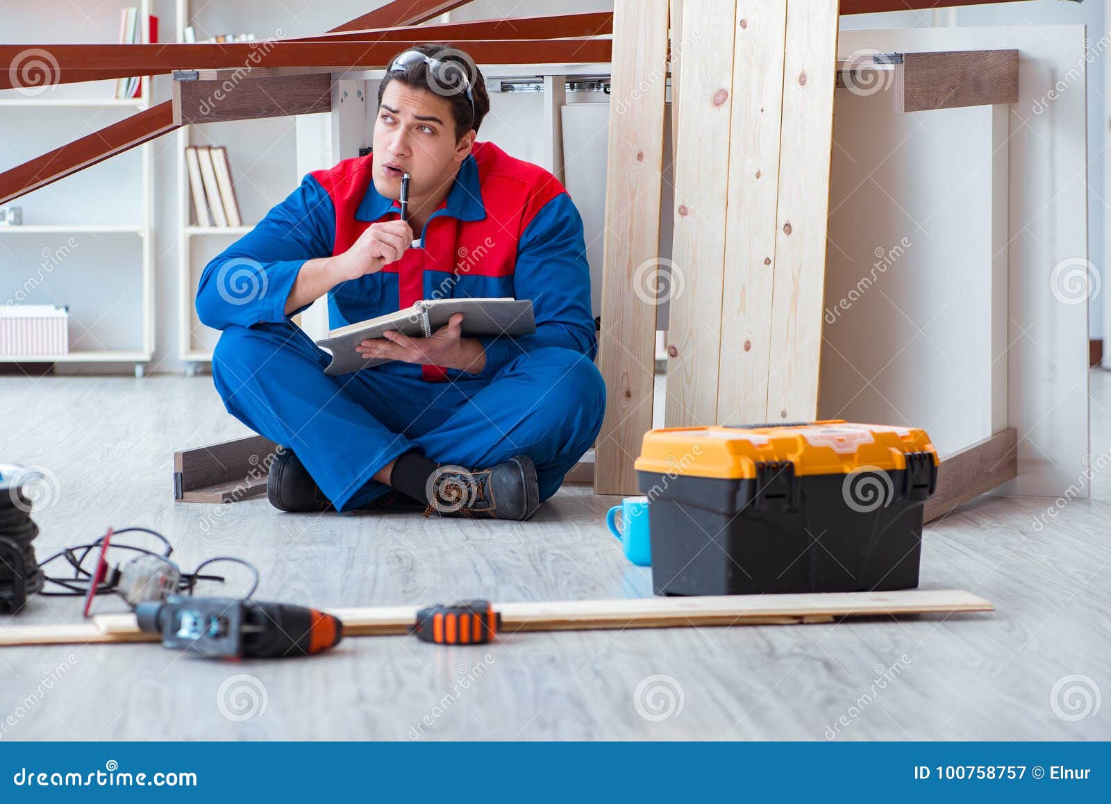 Young Carpenter with Notebook Writing Planning at Construction R Stock ...