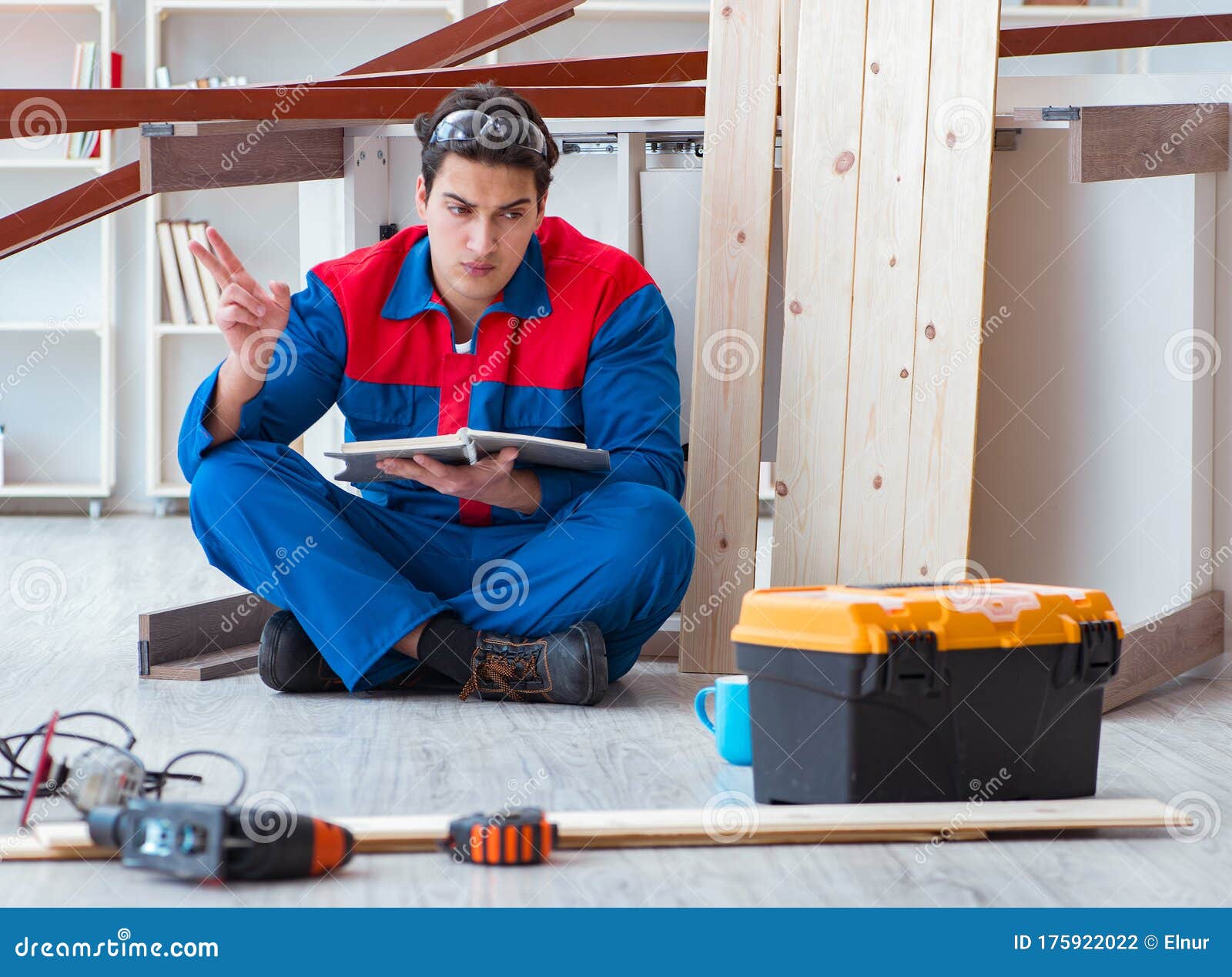 Young Carpenter with Notebook Writing Planning at Construction R Stock ...