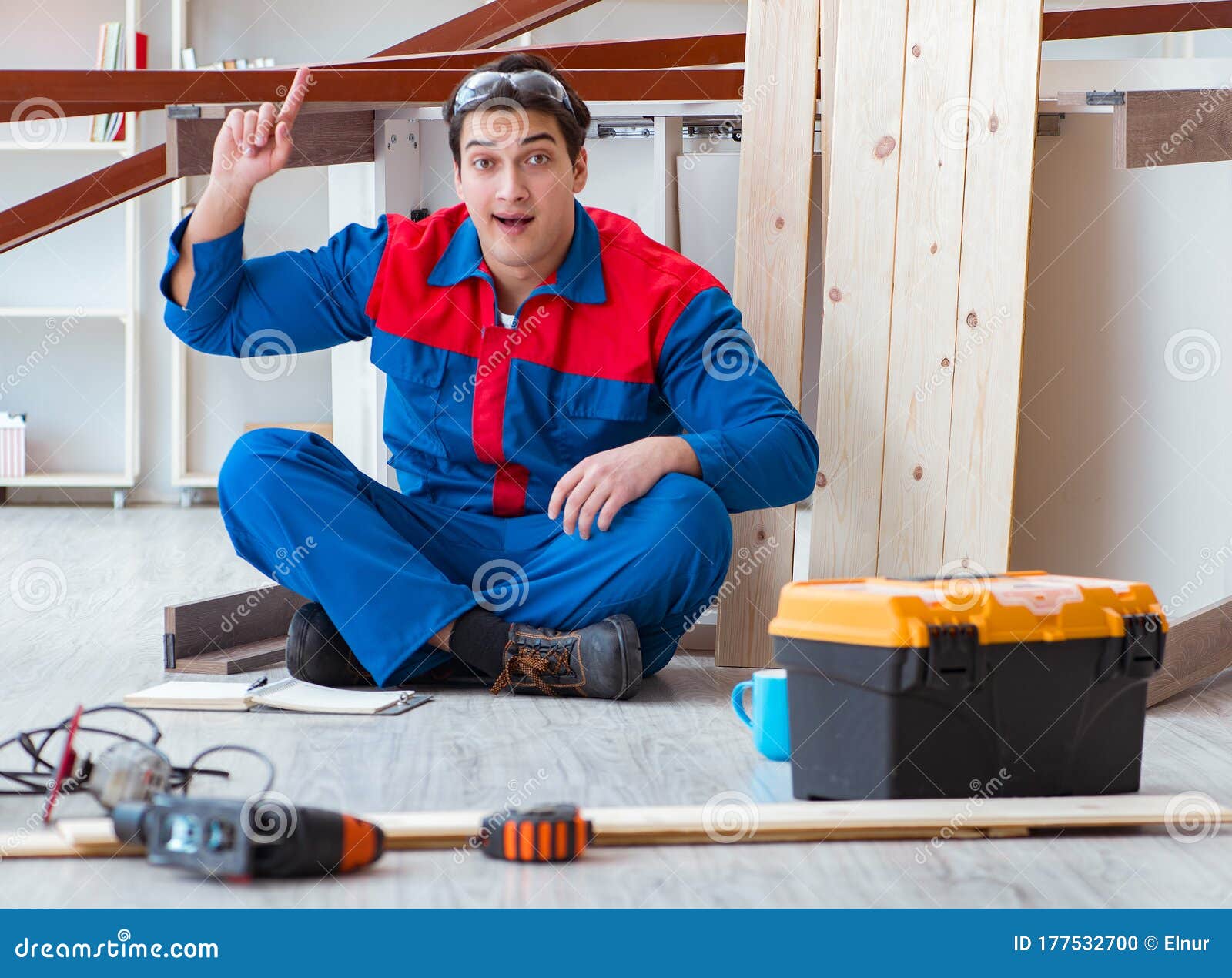 Young Carpenter with Notebook Writing Planning at Construction R Stock ...