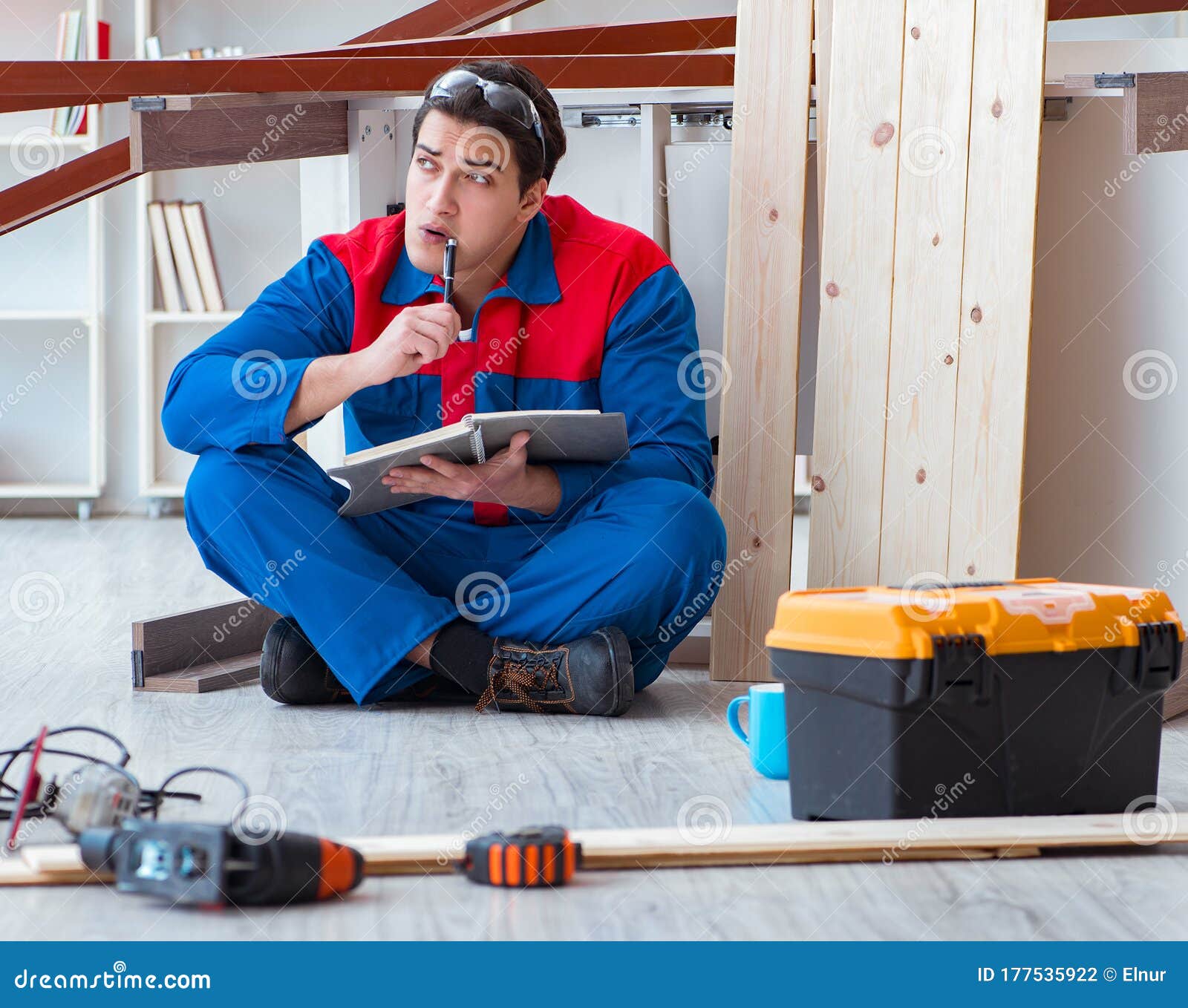 Young Carpenter with Notebook Writing Planning at Construction R Stock ...