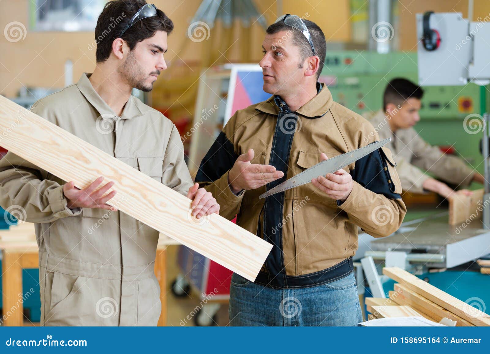 Young Carpenter Receiving Instruction from Supervisor Stock Photo ...