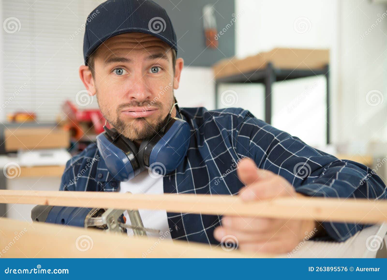 Young Carpenter Using Electric Hacksaw Stock Photo - Image of handyman ...