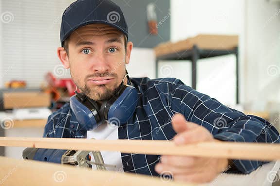 Young Carpenter Using Electric Hacksaw Stock Photo - Image of handyman ...