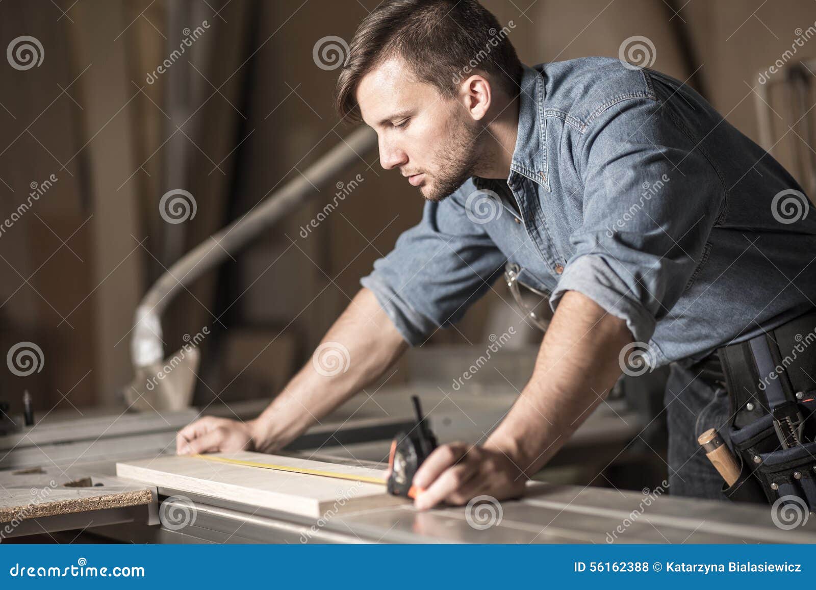 Young Carpenter Caucasoid Man Worker. He Looking Designs In Laptop ...