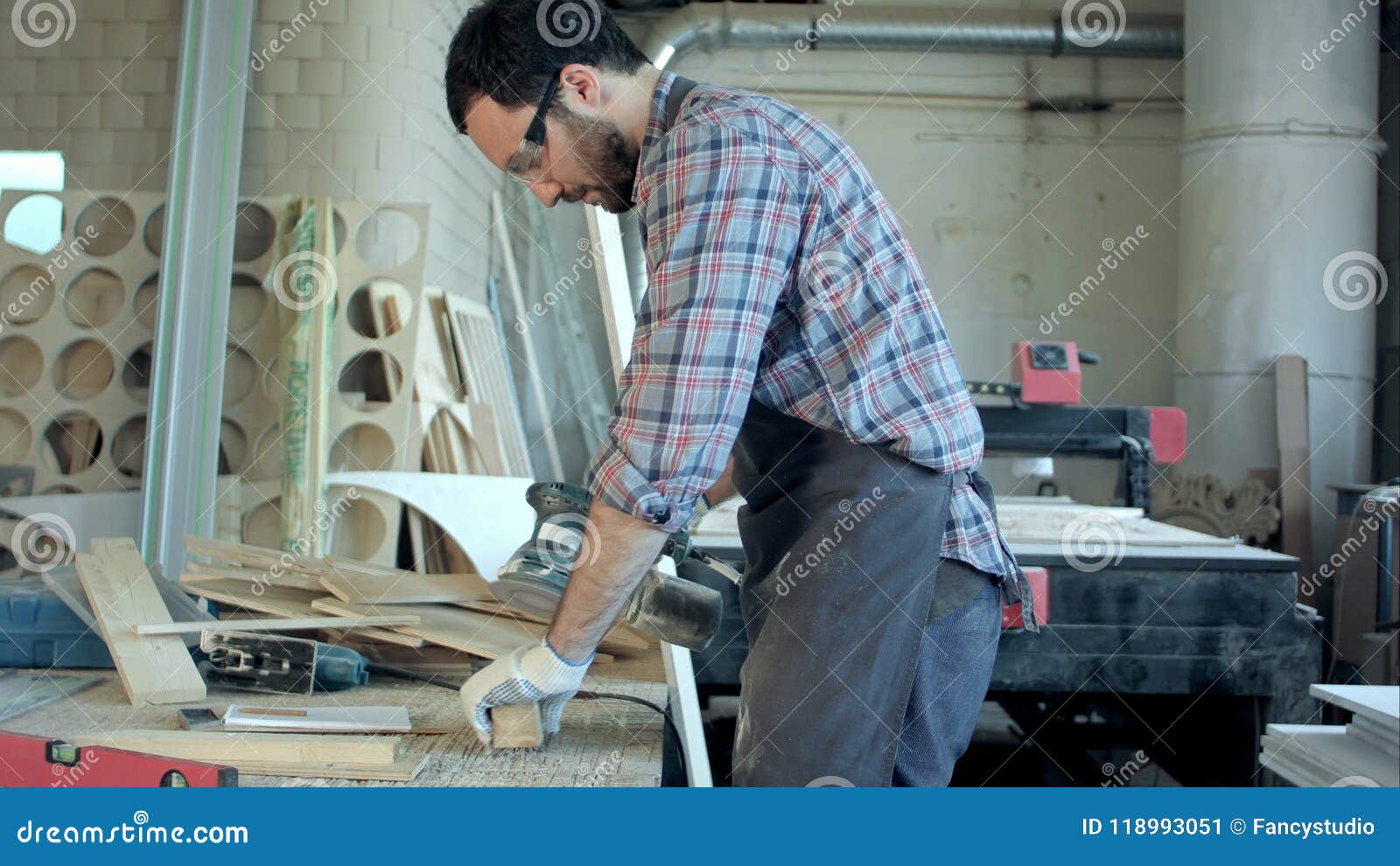Young Carpenter Working with Electric Machine in the Workshop Stock ...