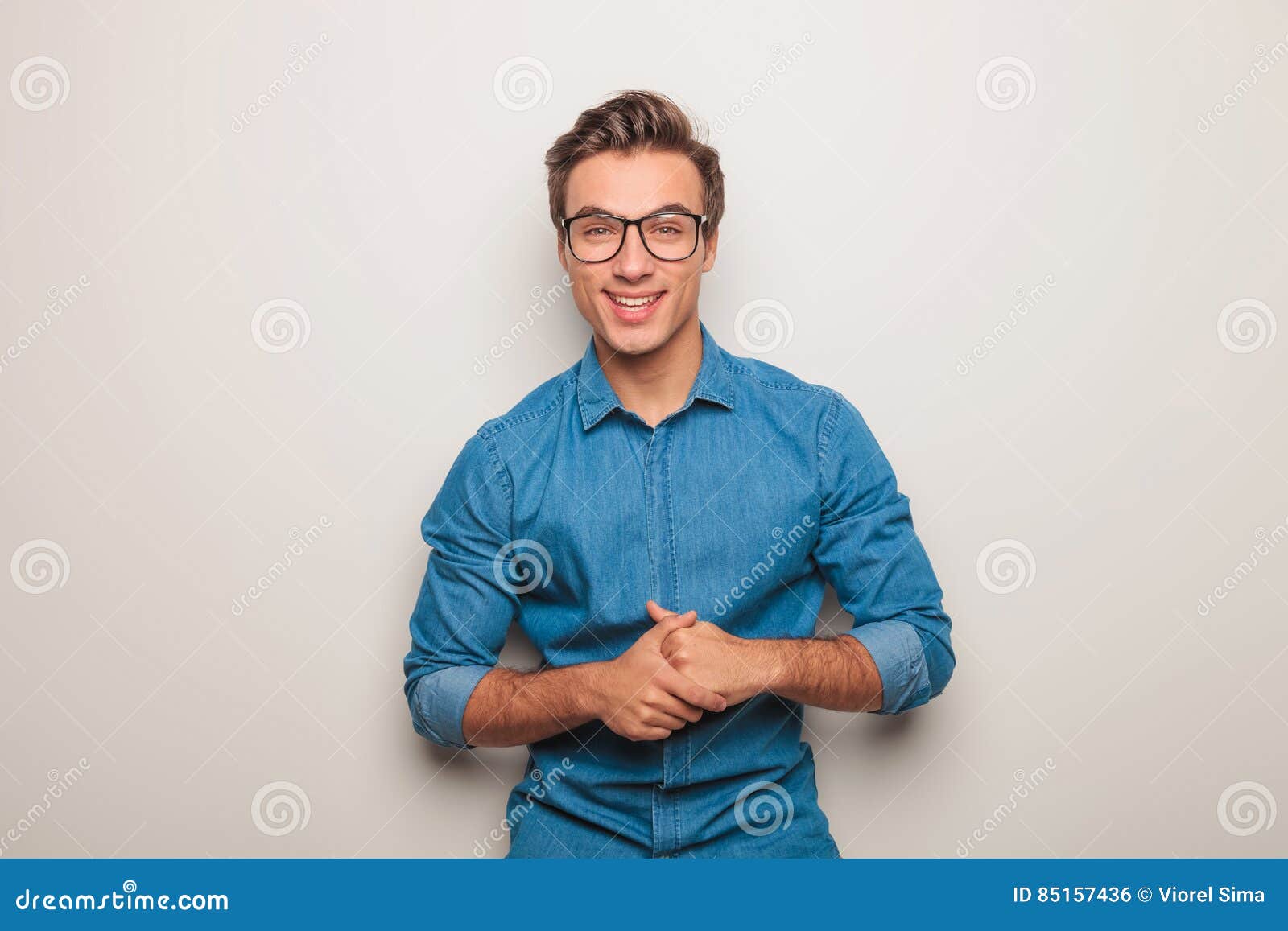 Young Casual Man in Blue Jeans Shirt Laughing Stock Photo - Image of ...