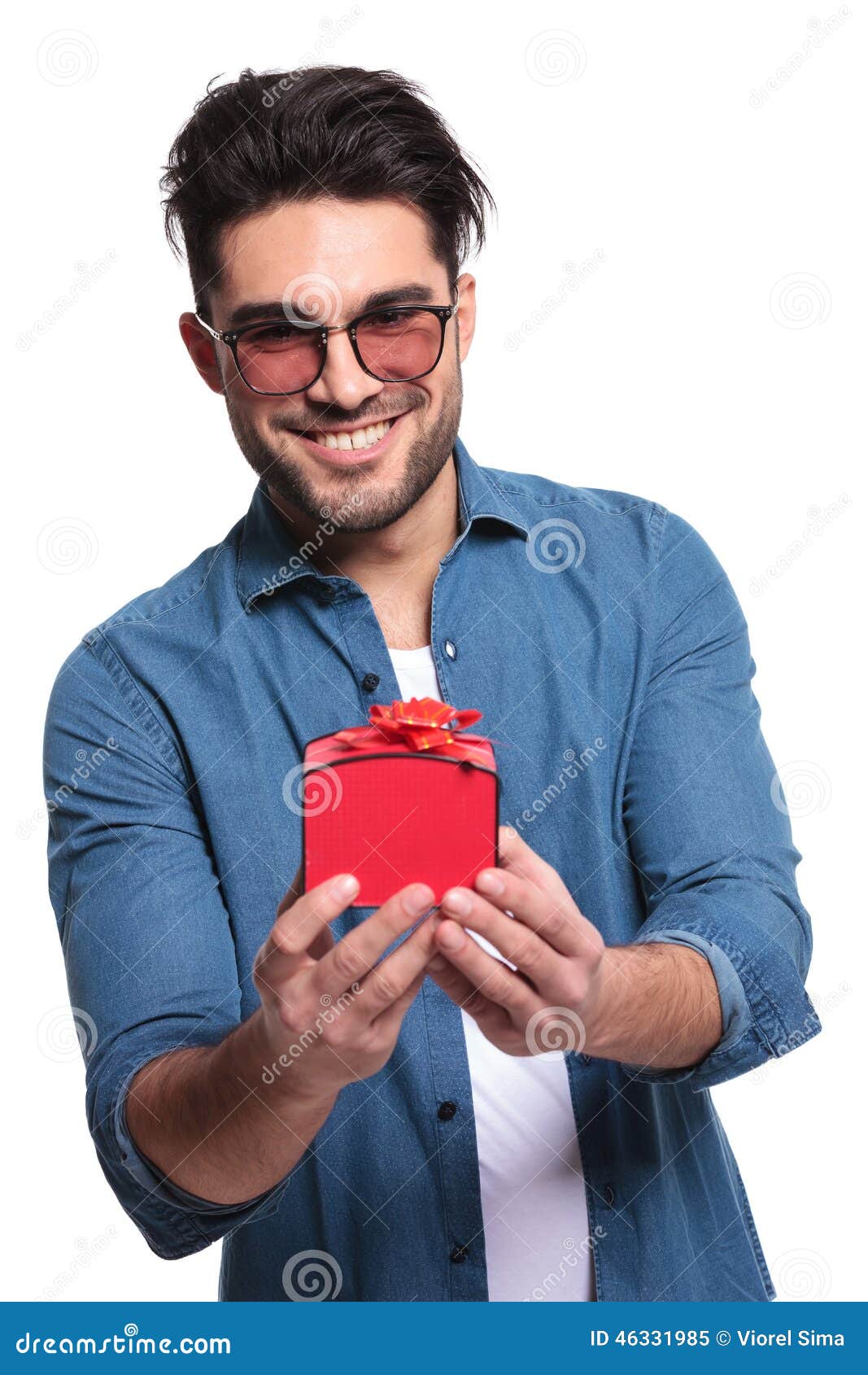 Young Casual Man Presenting a Small Red Gift Stock Image - Image of ...