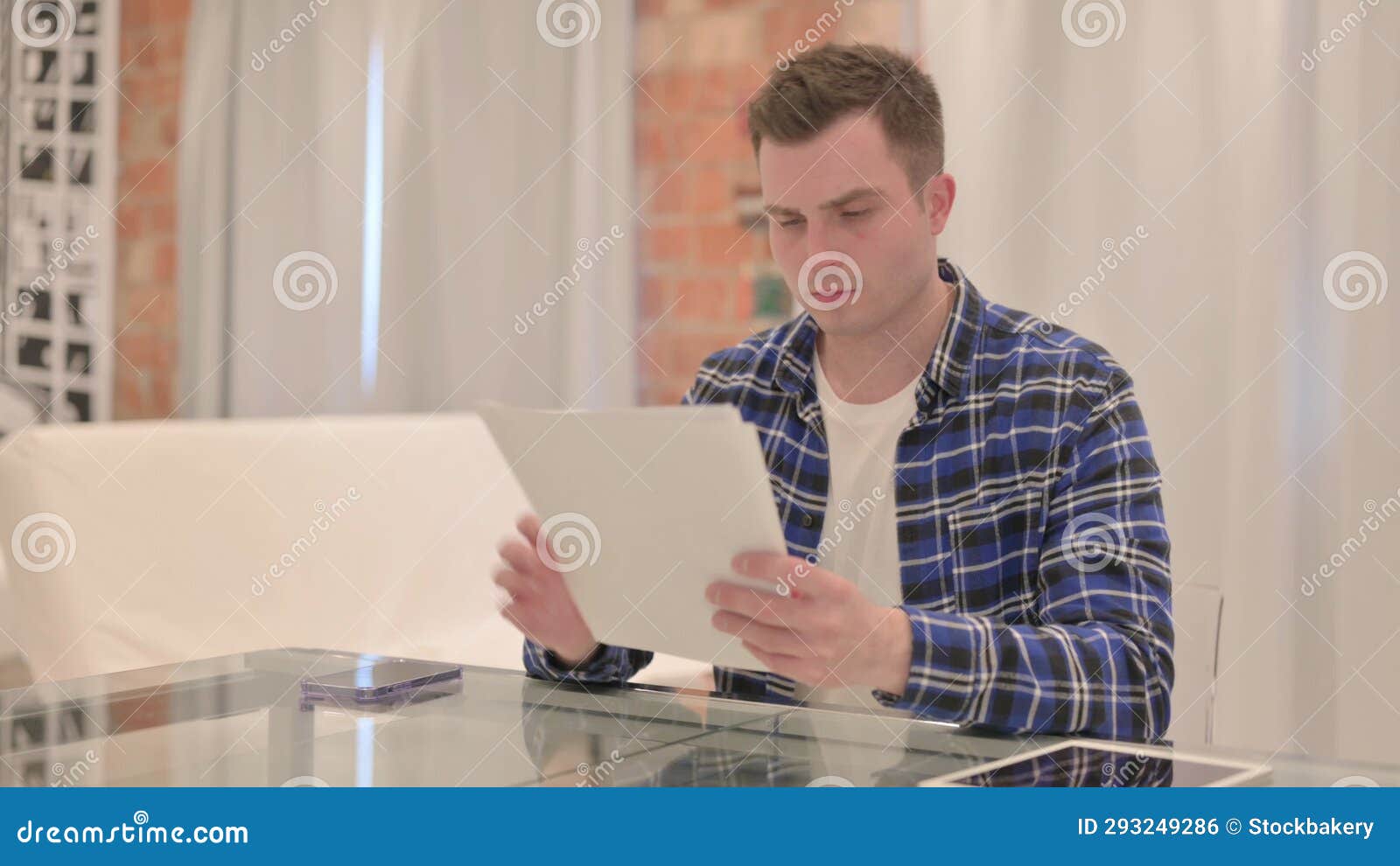 Young Casual Man Reading Documents at Work, Paperwork Stock Footage ...