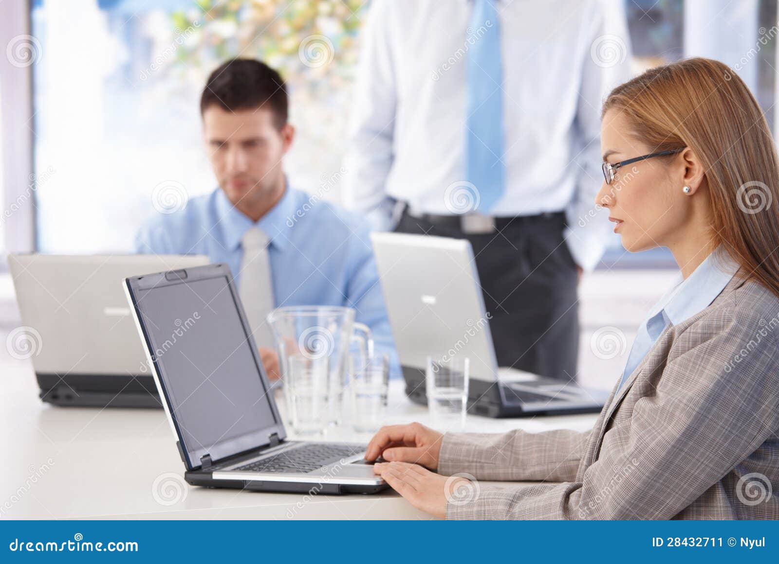 Young Casual Office Workers Working on Laptop Stock Image - Image of ...