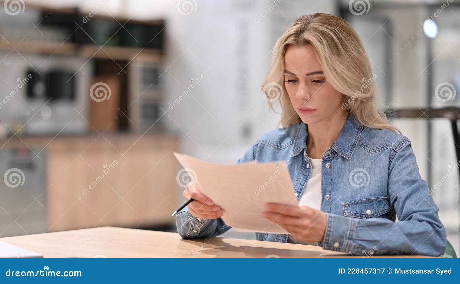Young Casual Woman Reading Documents at Work Stock Image - Image of ...