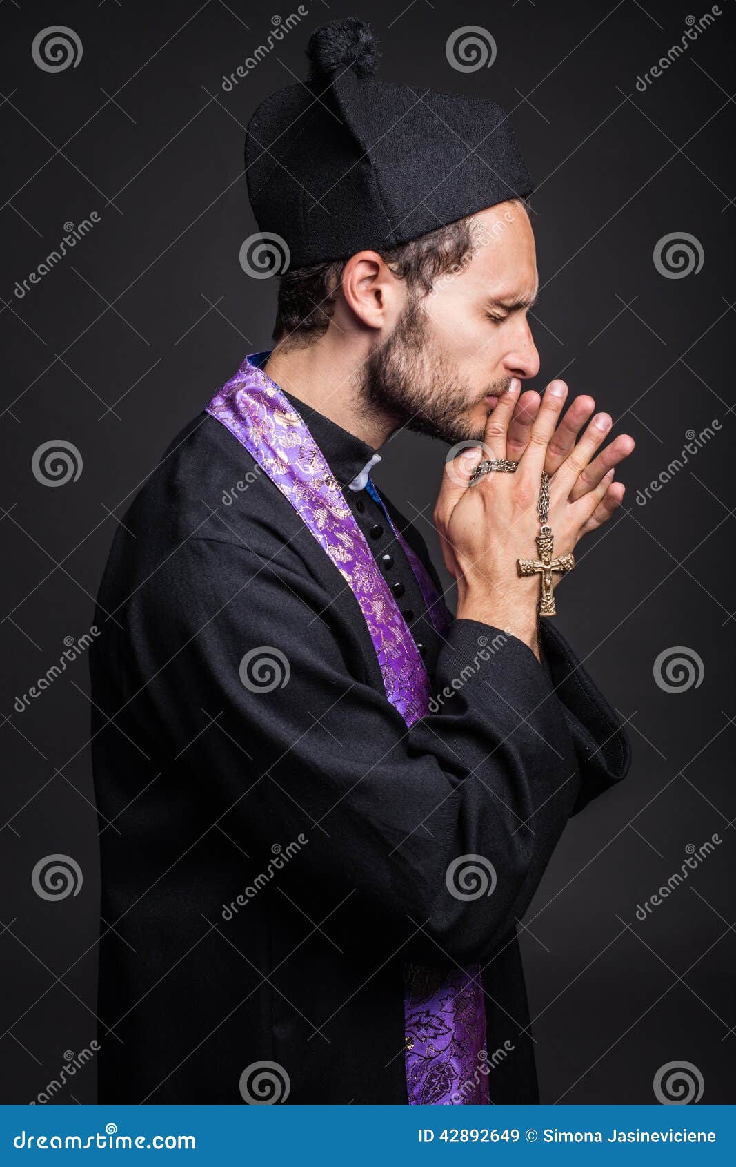 Young Catholic Praying Priest. Portrait Of Priest Next To The Candles ...