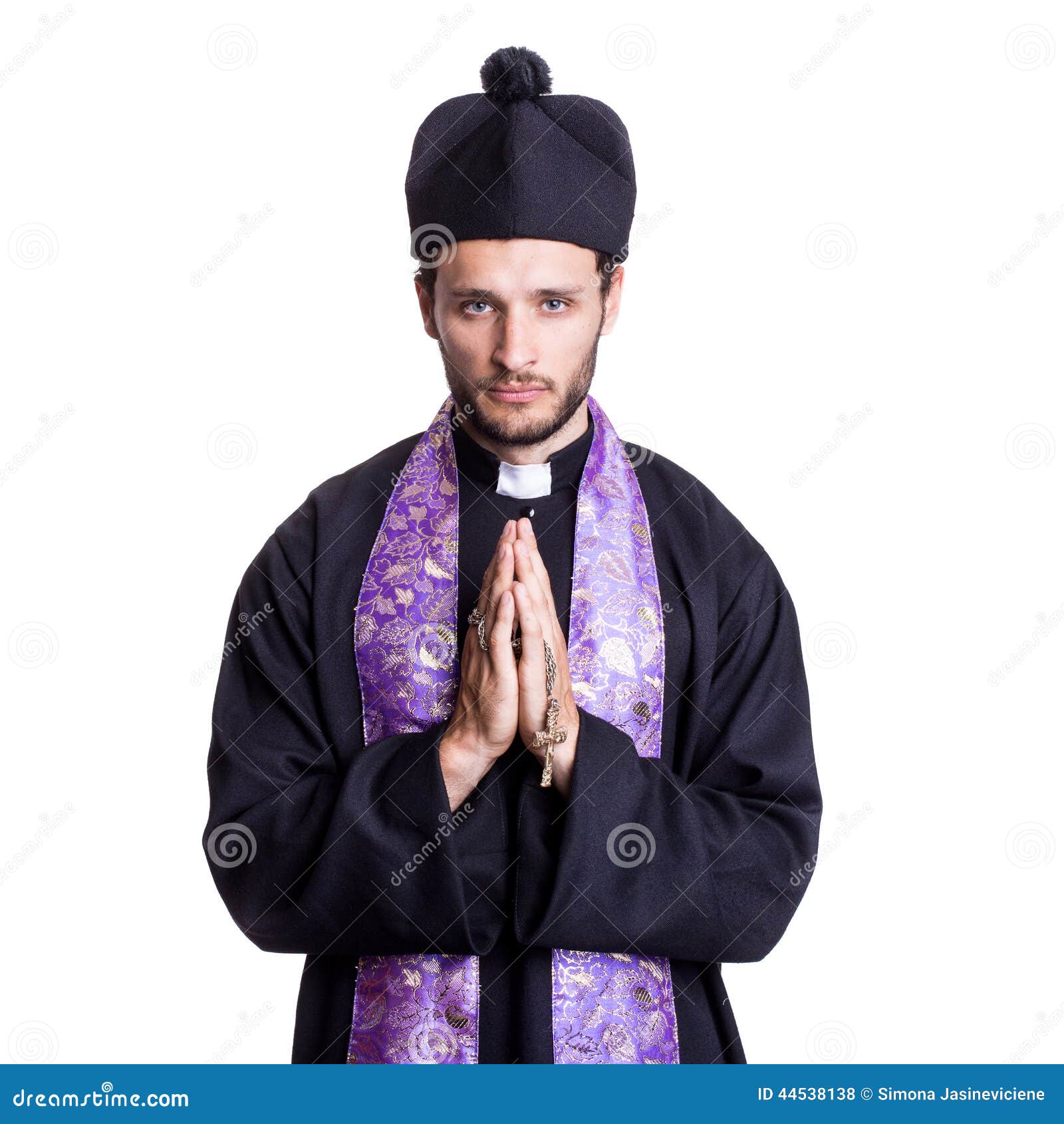 Young Catholic Praying Priest. Portrait Of Priest Next To The Candles ...