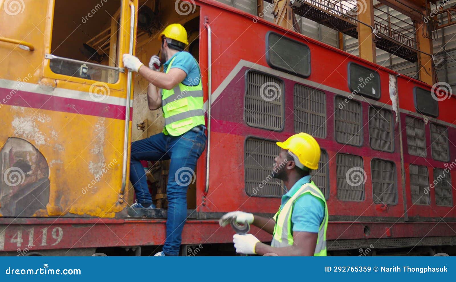 Young Caucasian and Black Engineer Maintenance and Repair Train Diesel ...