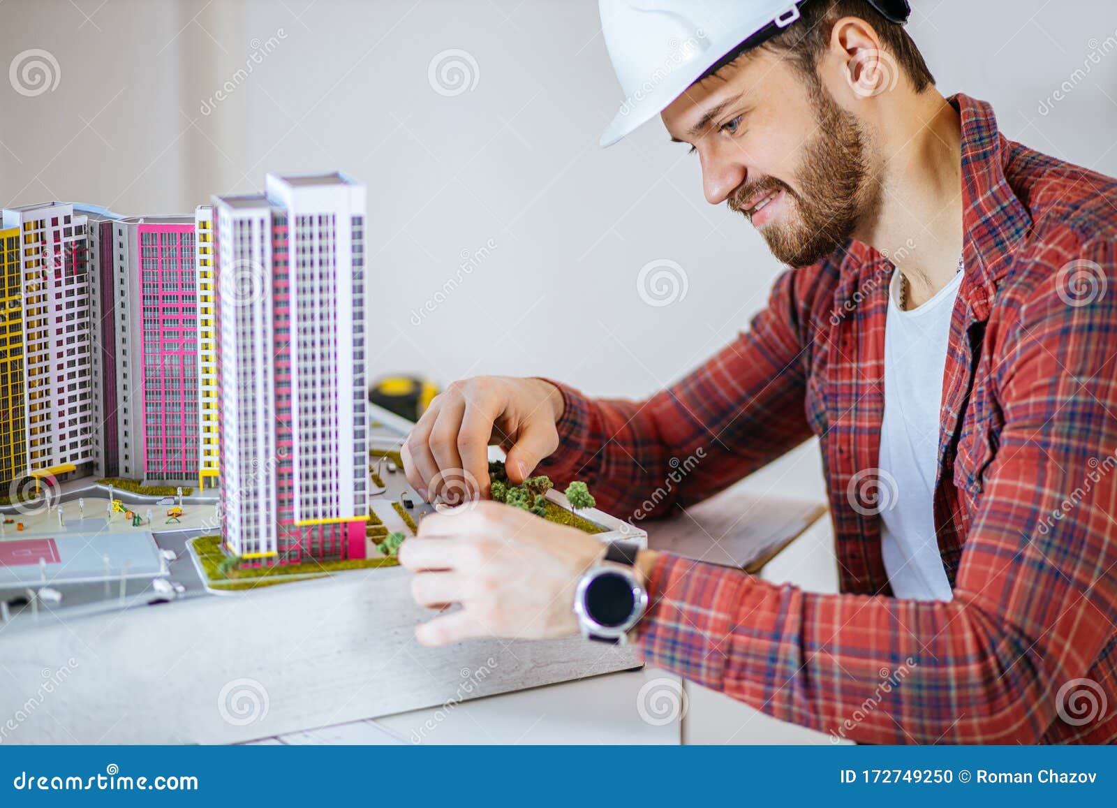 Young Builder Assemble Complex Building Model, Construction Stock Photo ...