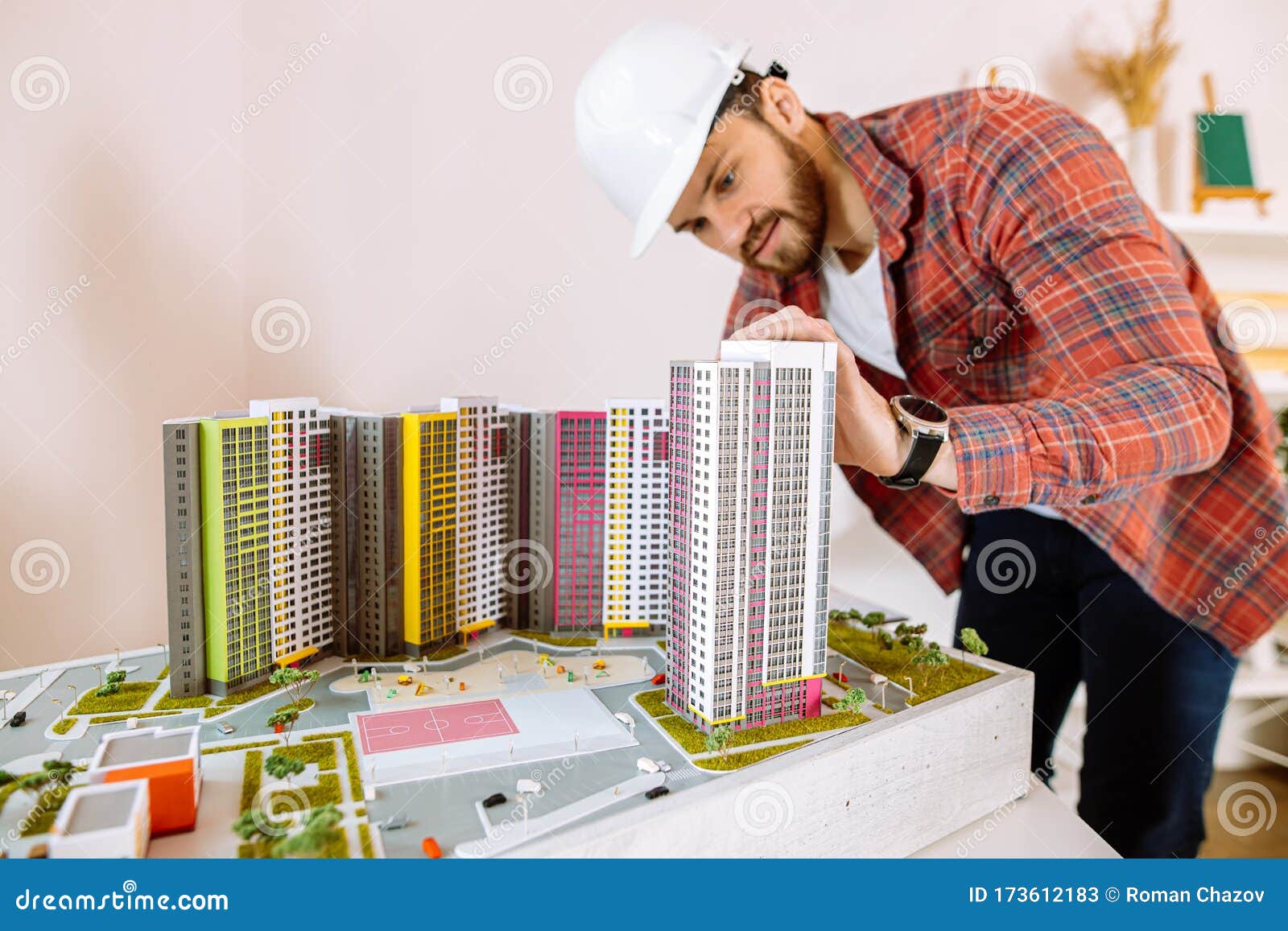 Young Builder Assemble Complex Building Model, Construction Stock Image ...