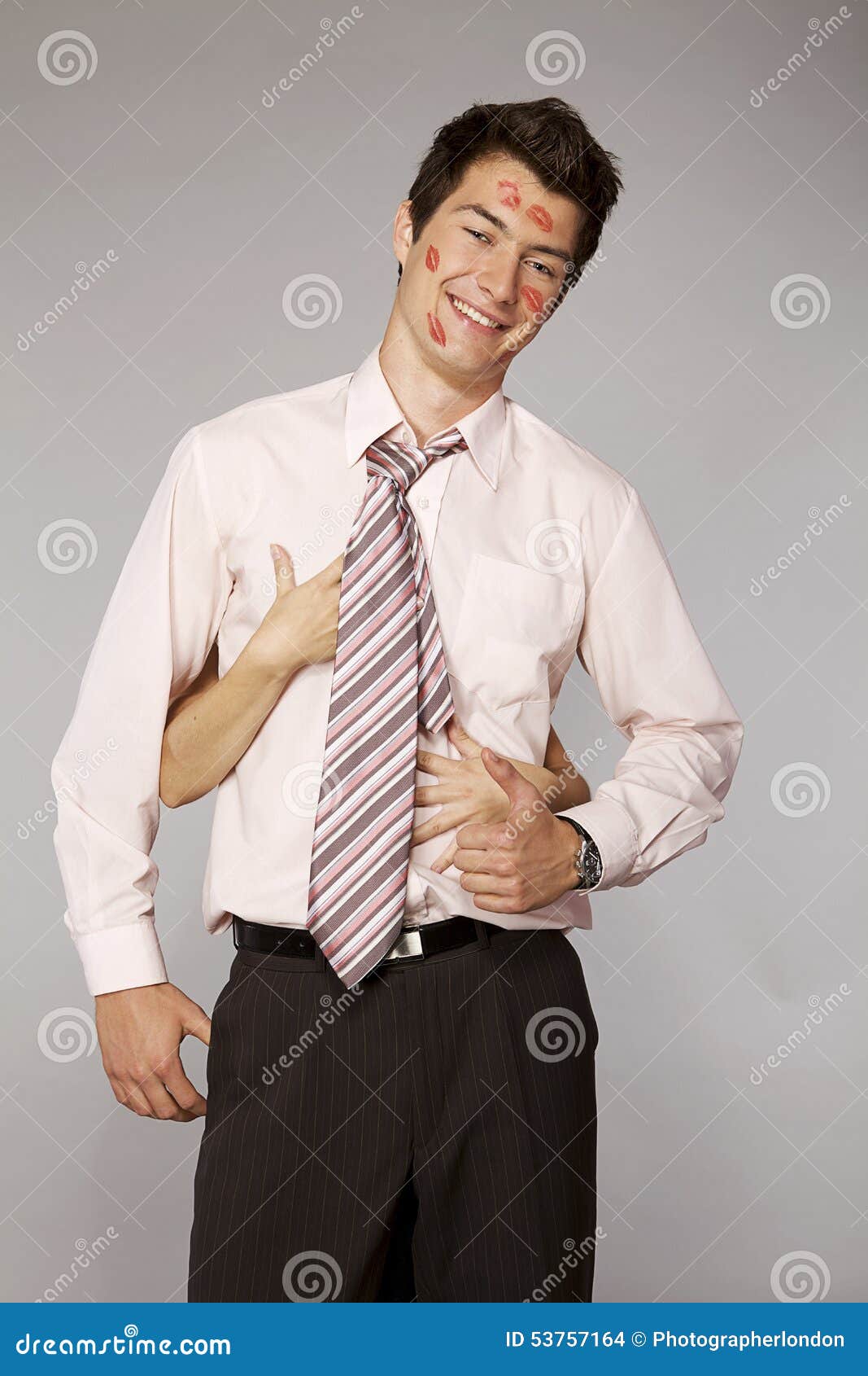 Young Caucasian Businessman With Lipstick Kiss Mark On His Cheek Stock