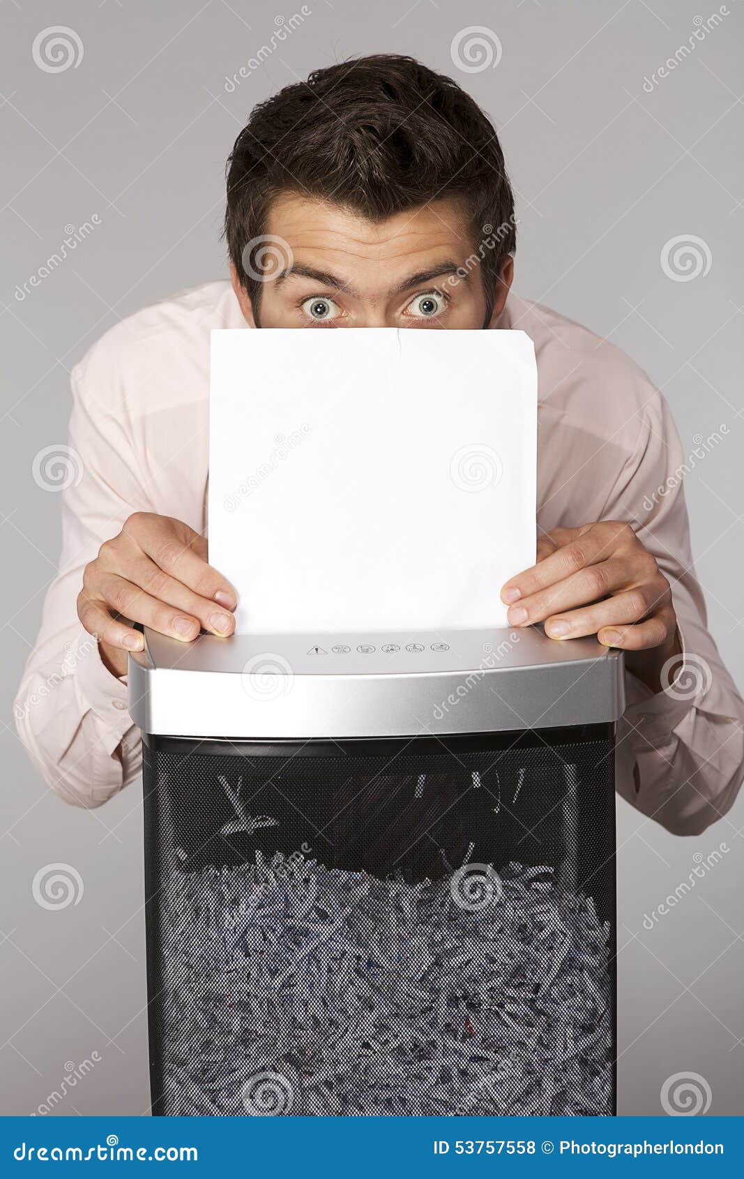 Young Caucasian Businessman Shredding Documents Stock Photo - Image of ...