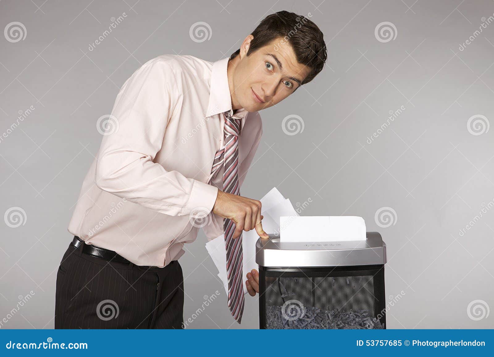 Young Caucasian Businessman Shredding Documents Stock Image - Image of ...
