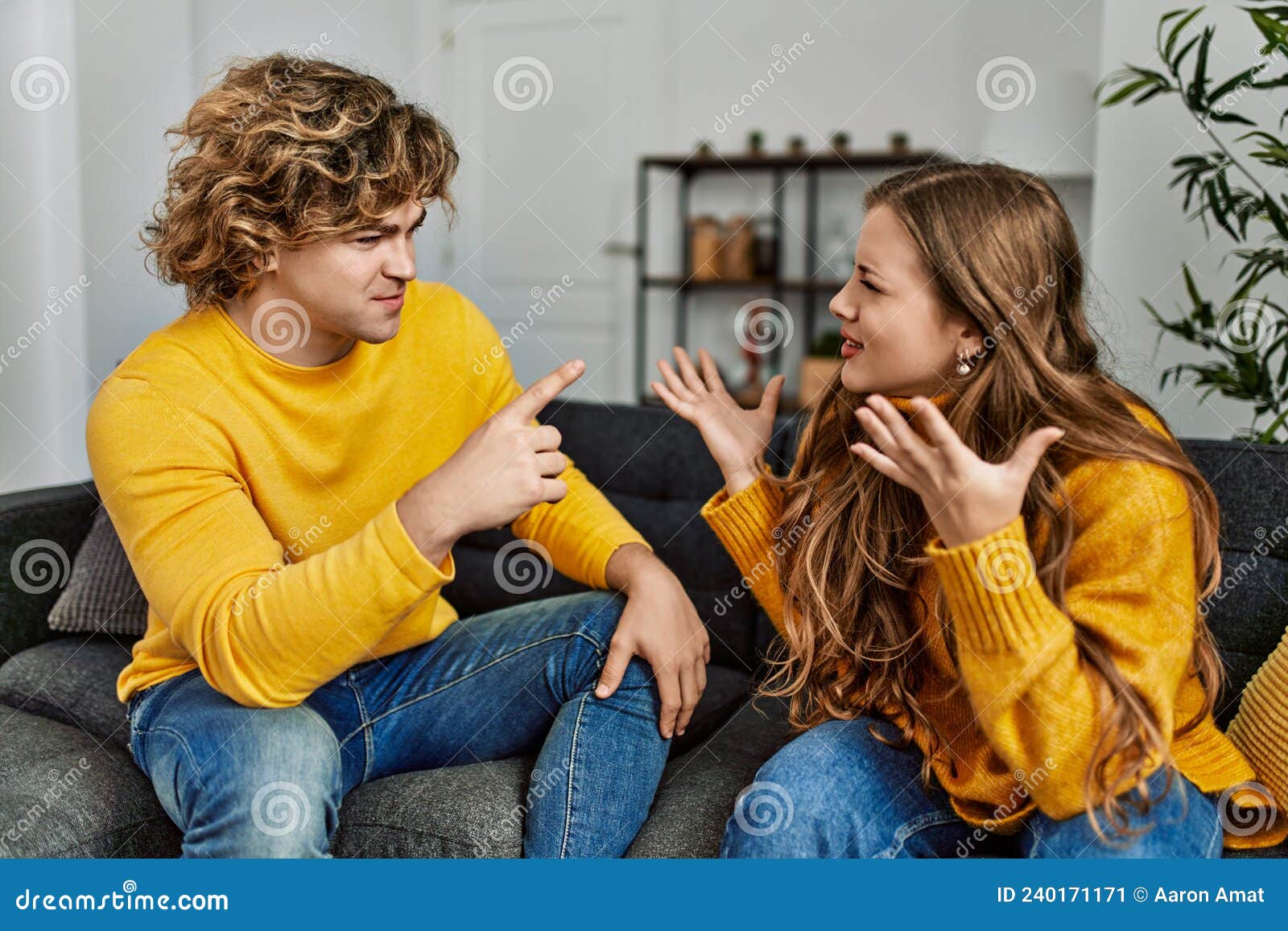Young Caucasian Couple Arguing Sitting on Sofa at Home Stock Image ...
