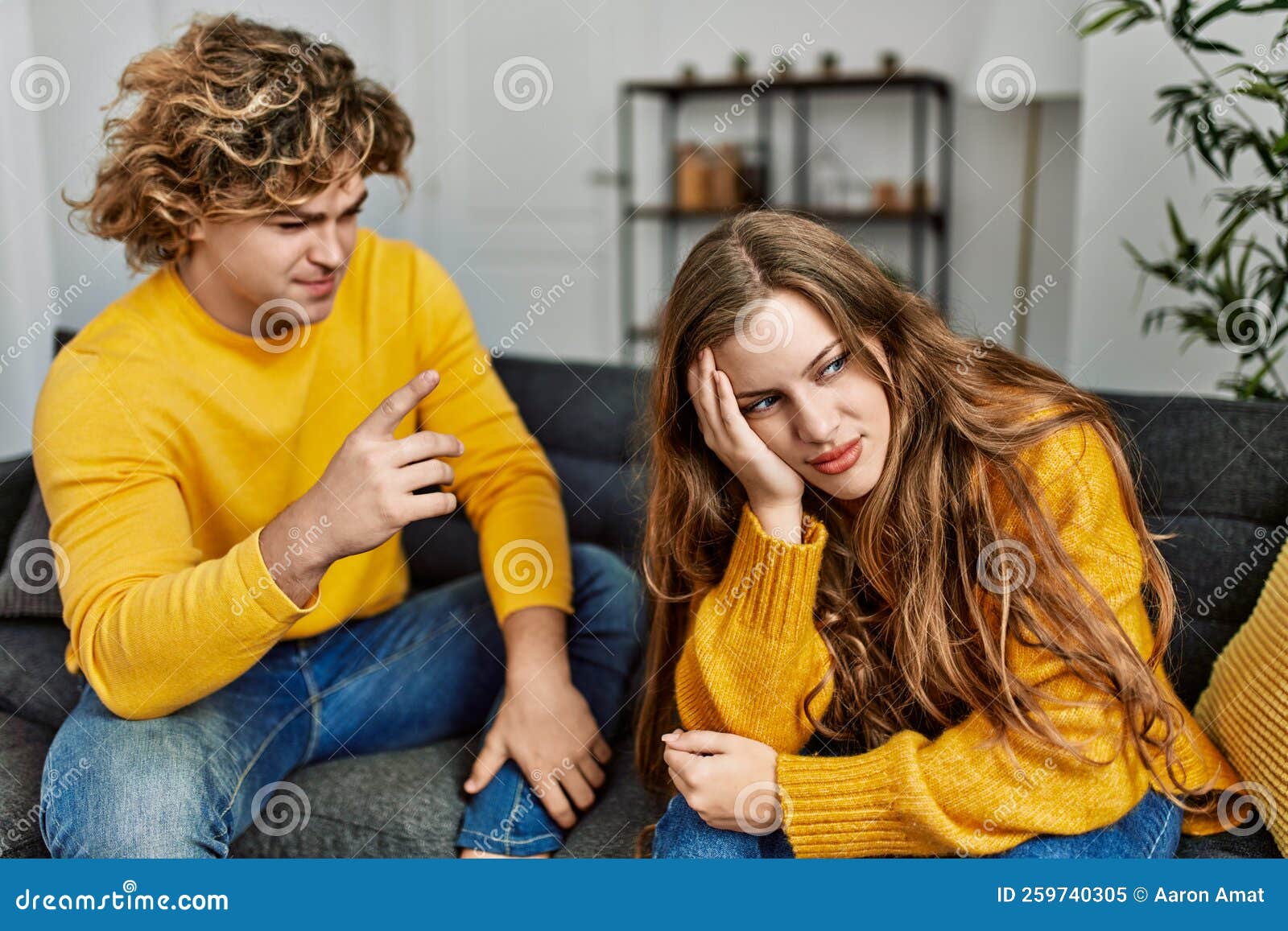Young Caucasian Couple Arguing Sitting on Sofa at Home Stock Image ...