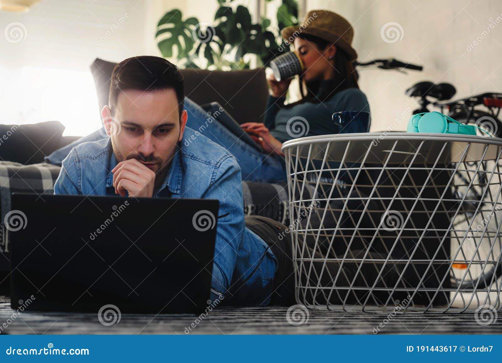 Young Caucasian Couple Using Mobile Devices for Work from Home Stock ...