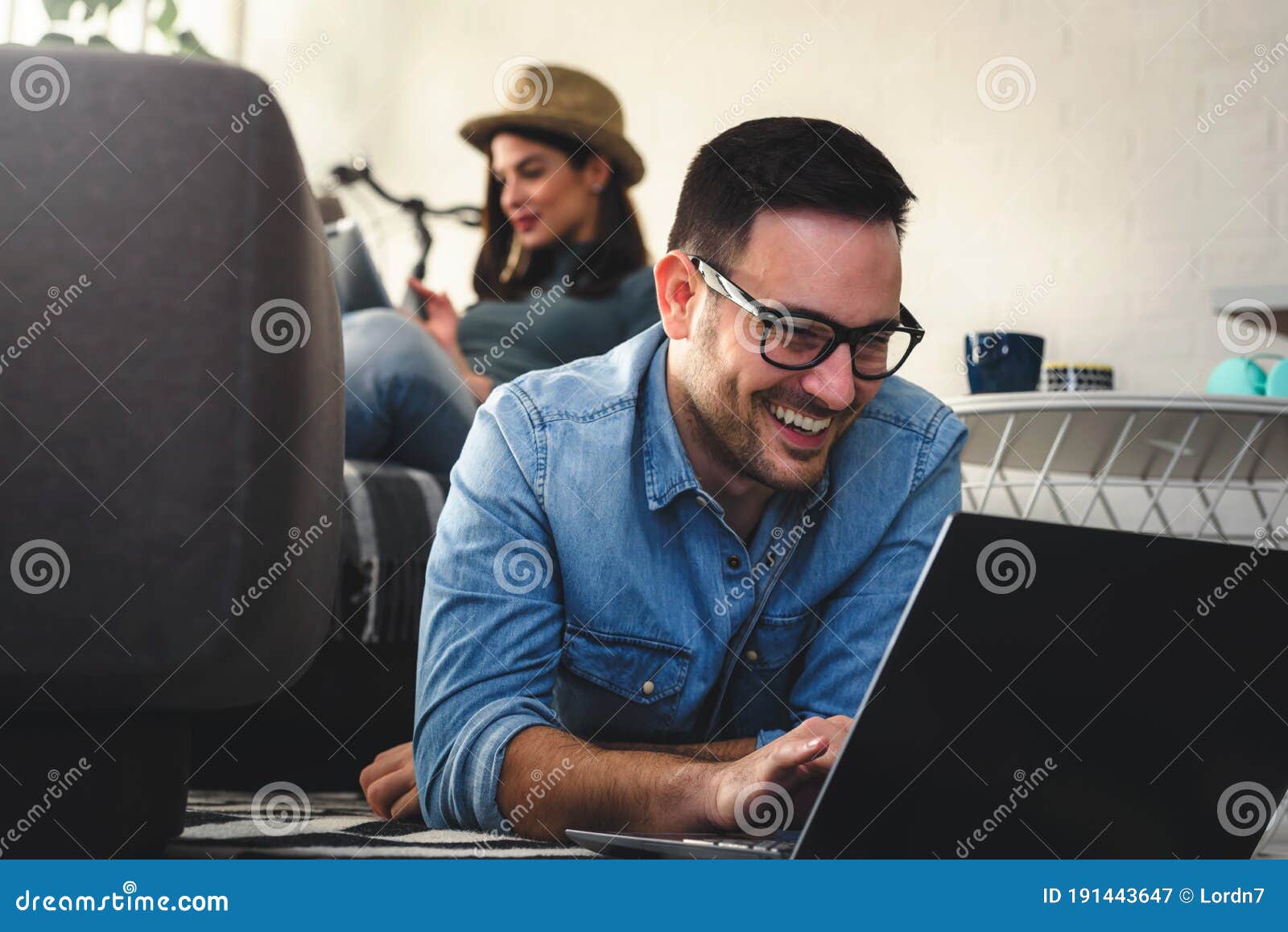 Young Caucasian Couple Using Mobile Devices for Work from Home Stock ...