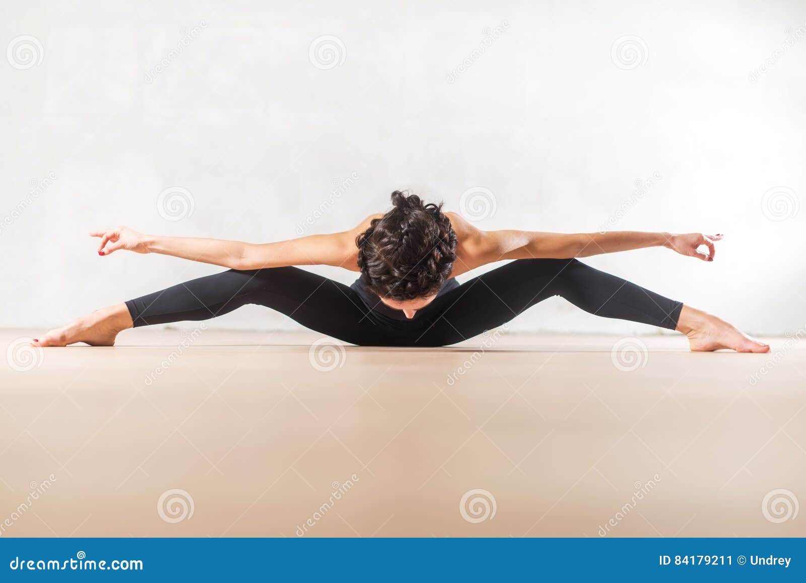Young Caucasian Dancer Doing Seated Wide Leg Forward Bend Exercise ...