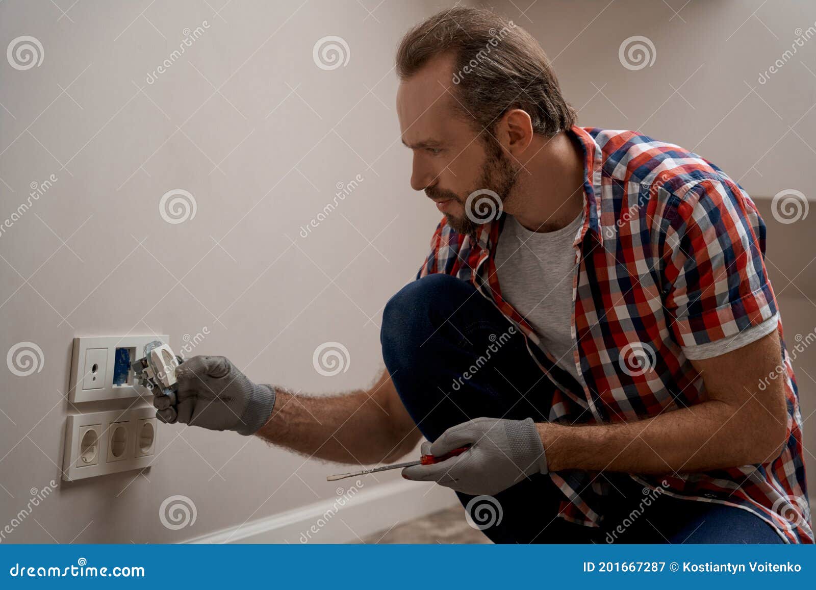 Young Caucasian Electrical Engineer Installing Power Sockets Stock ...