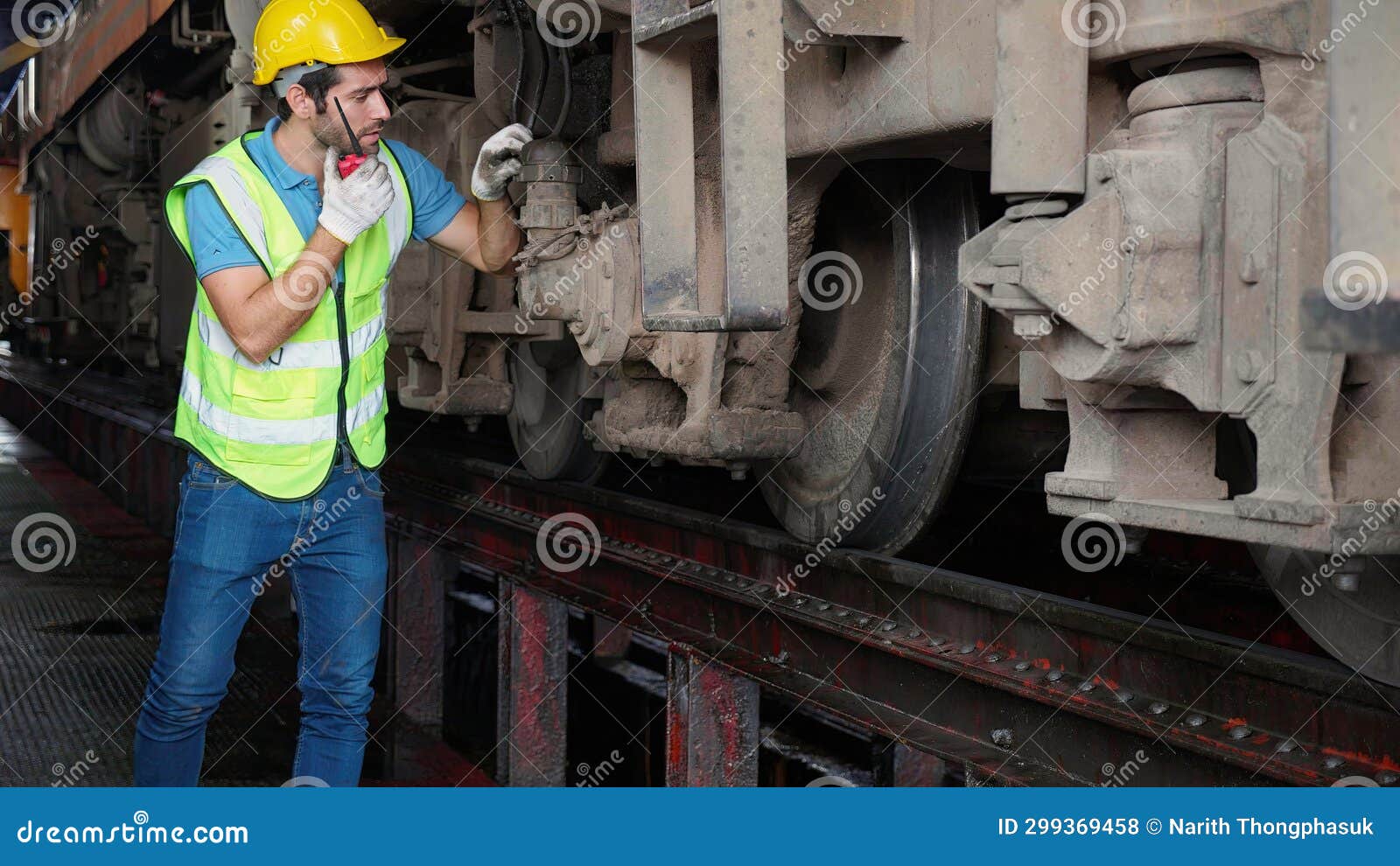 Young Caucasian Engineer Man Maintenance and Repair Train Diesel Engine ...