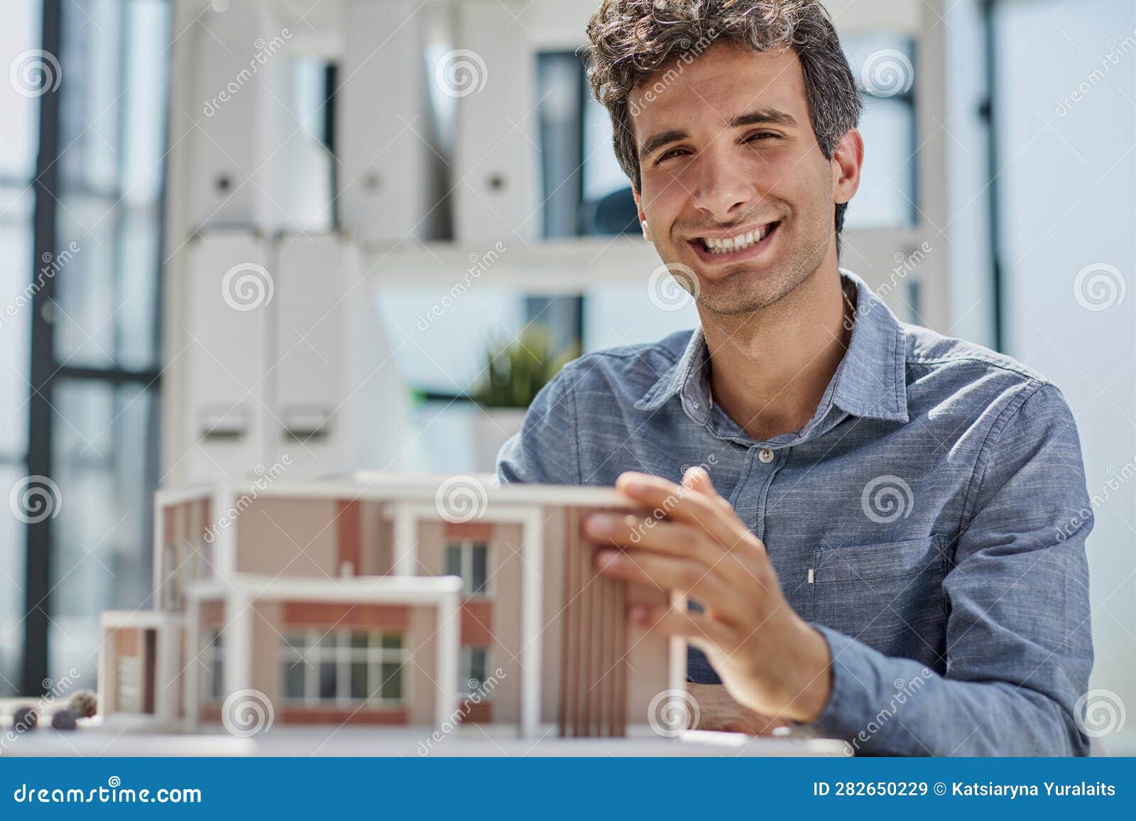 Young Caucasian Engineer Man Making Building Model with the Use of ...