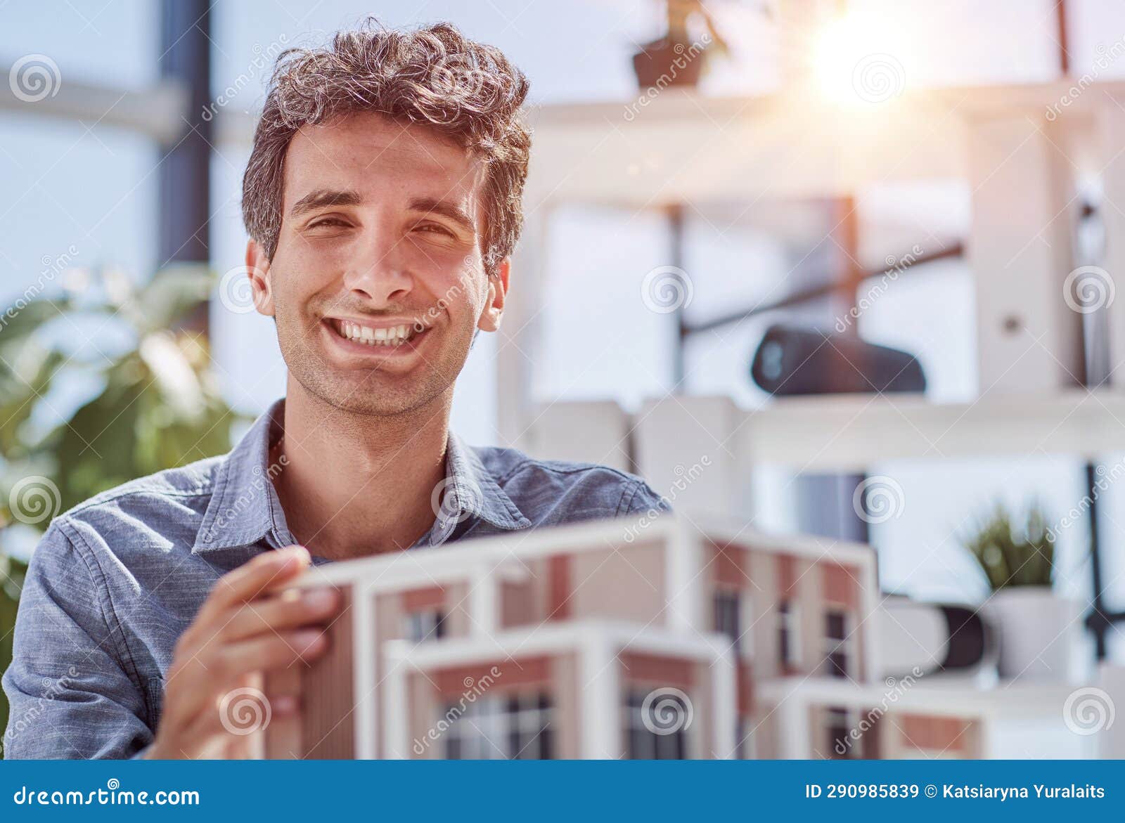 Young Caucasian Engineer Man Making Building Model with the Use of ...